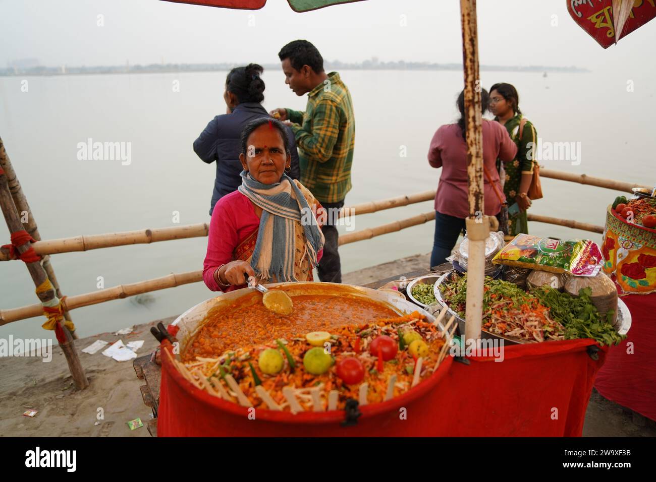 Uluberia, West Bengal, India. 30th Dec, 2023. Along the glimmering ...