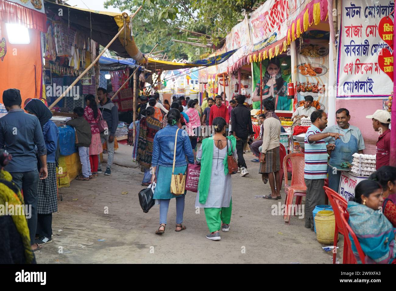 Uluberia, West Bengal, India. 30th Dec, 2023. Along the glimmering ...