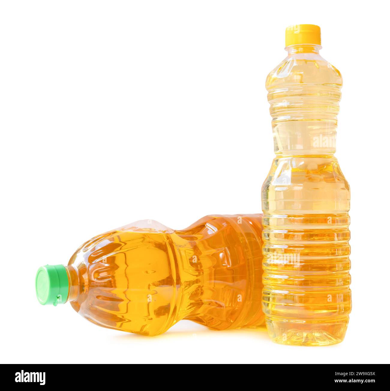 Two bottles of vegetable oils in stack are isolated on white background ...