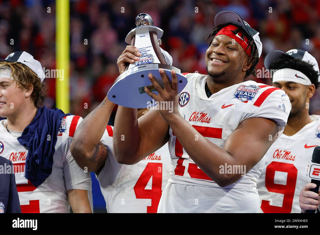 Atlanta, Georgia. 30th Dec, 2023. Jared Ivey of Ole Miss is awarded the ...