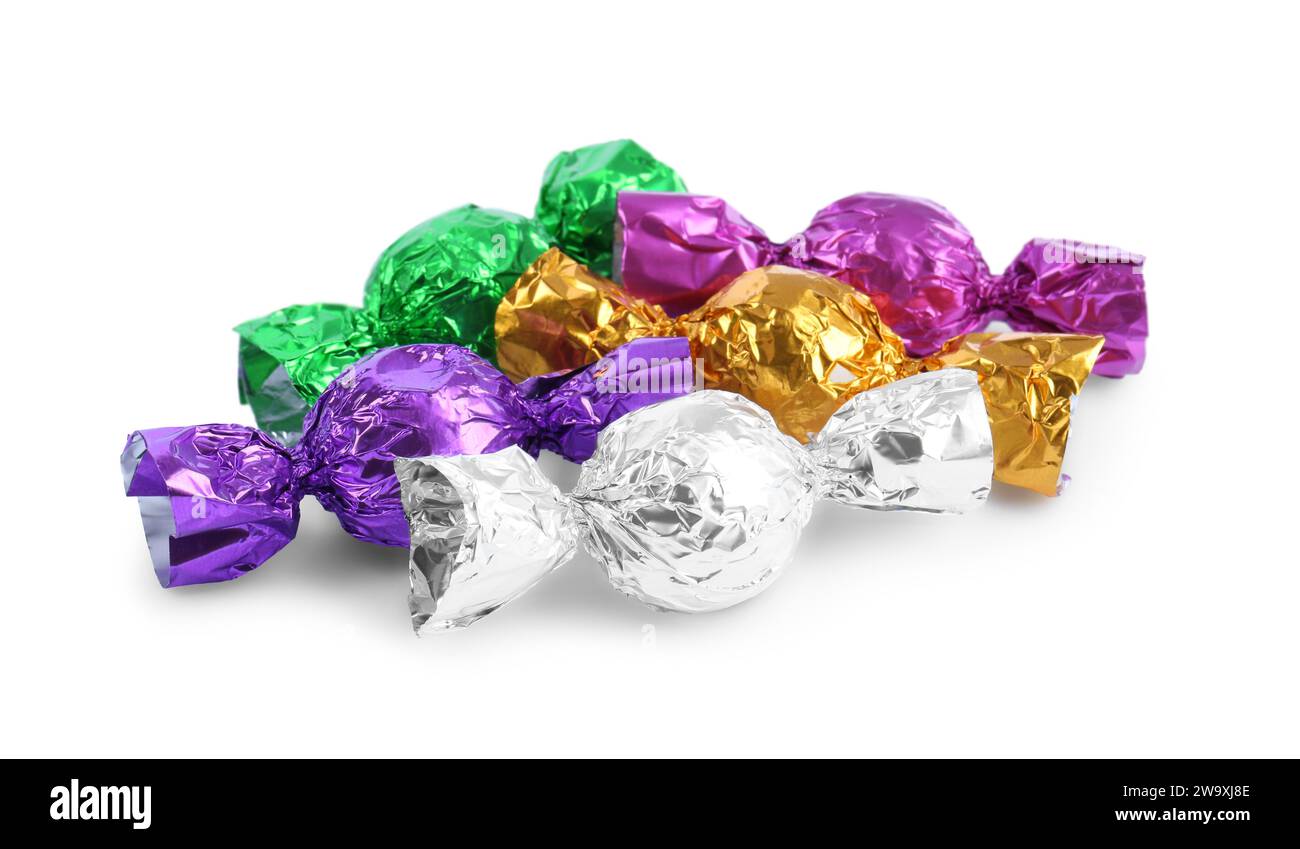 Tasty candies in colorful wrappers isolated on white Stock Photo - Alamy