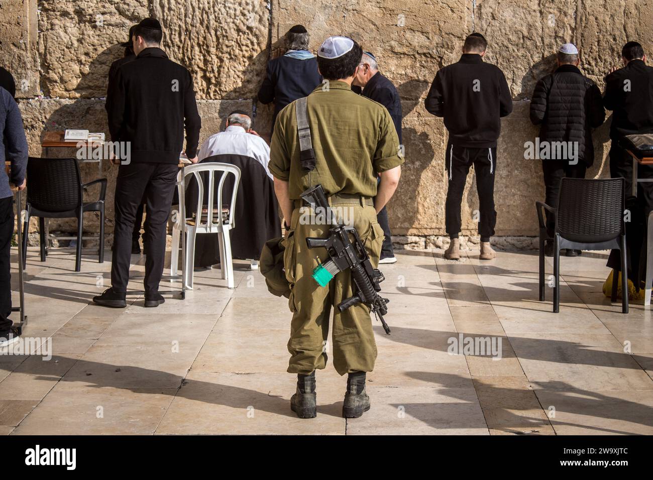 An IDF soldier prays at the Western Wall in Jerusalem. Soldiers ...
