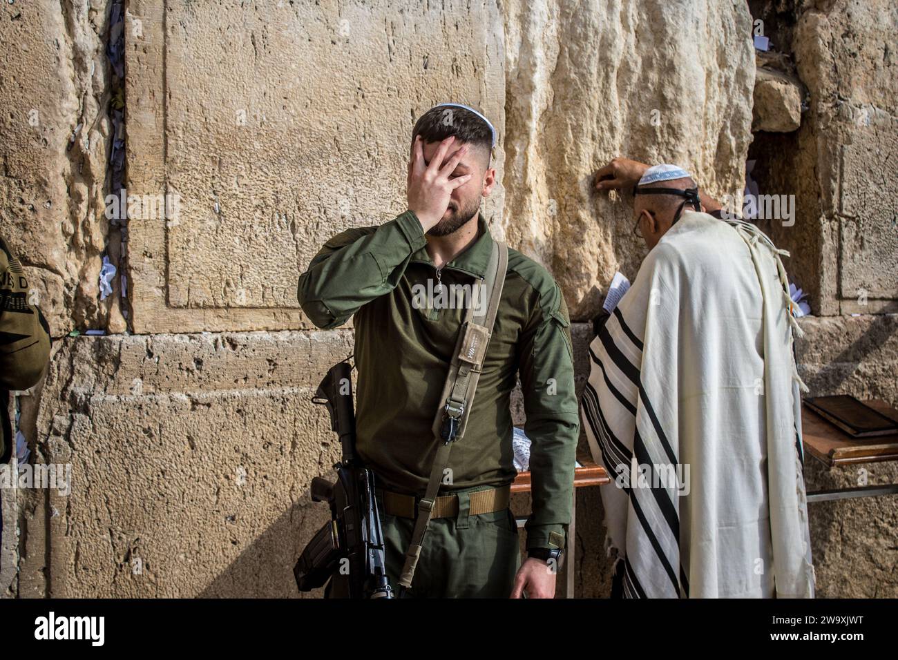 An IDF soldier prays at the Western Wall in Jerusalem. Soldiers ...