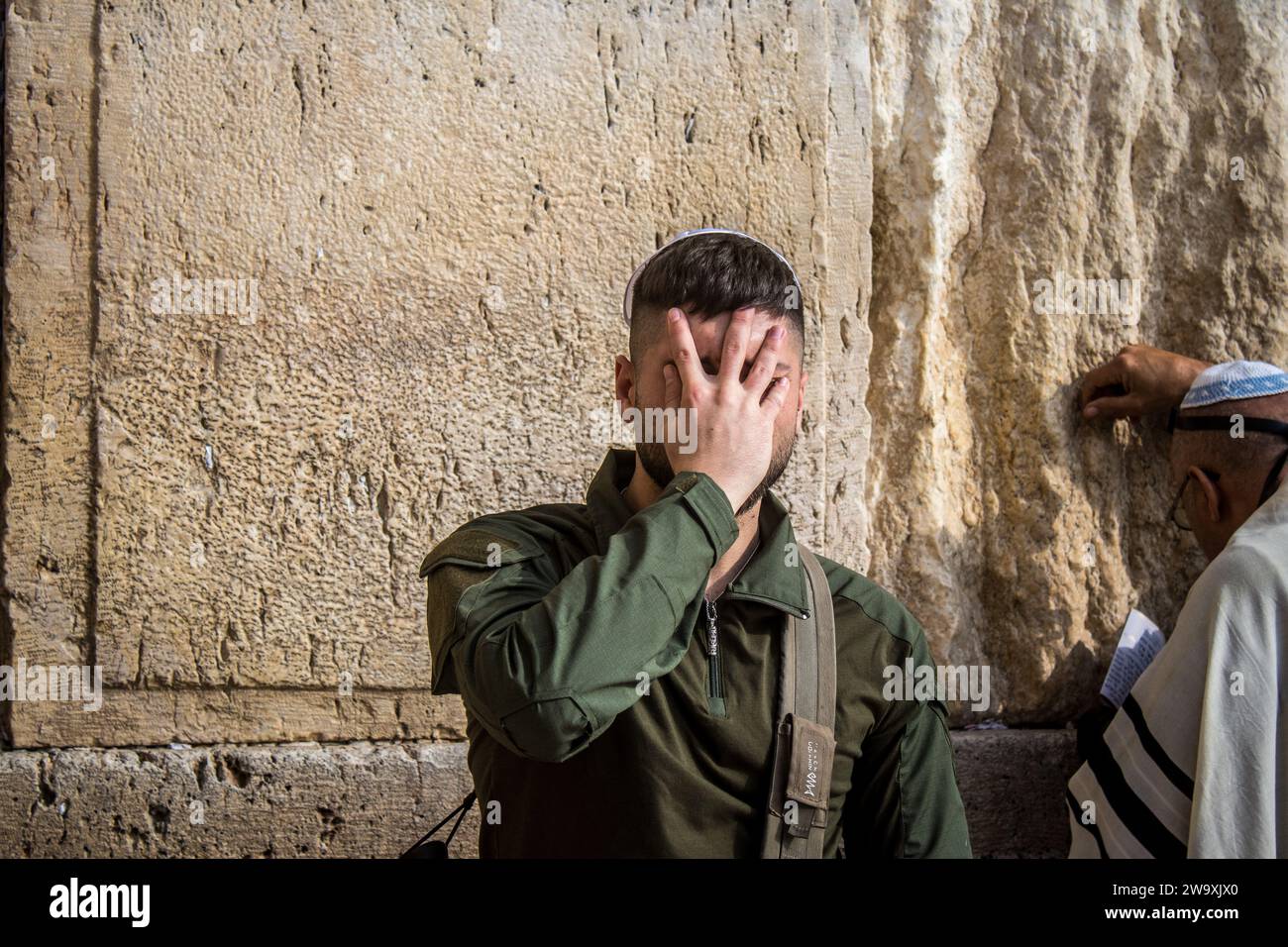 An IDF soldier prays at the Western Wall in Jerusalem. Soldiers ...