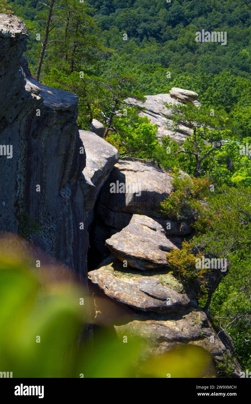 Layered rocks leading to the top of a cliff Stock Photo - Alamy