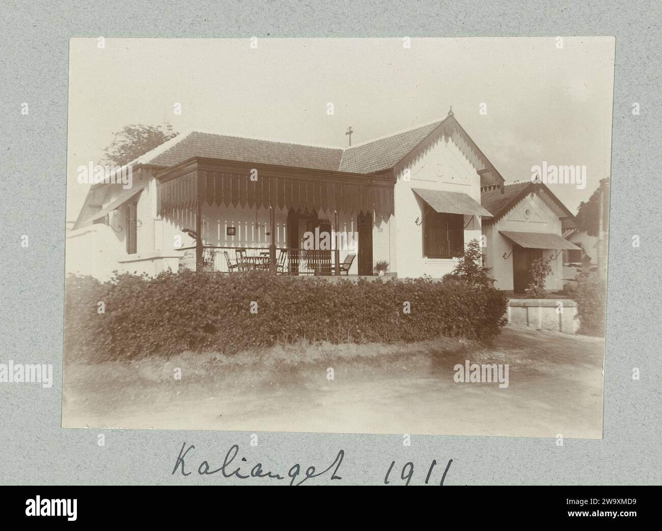 House with a large veranda in Kalianget, c. 1910 photograph The men ...