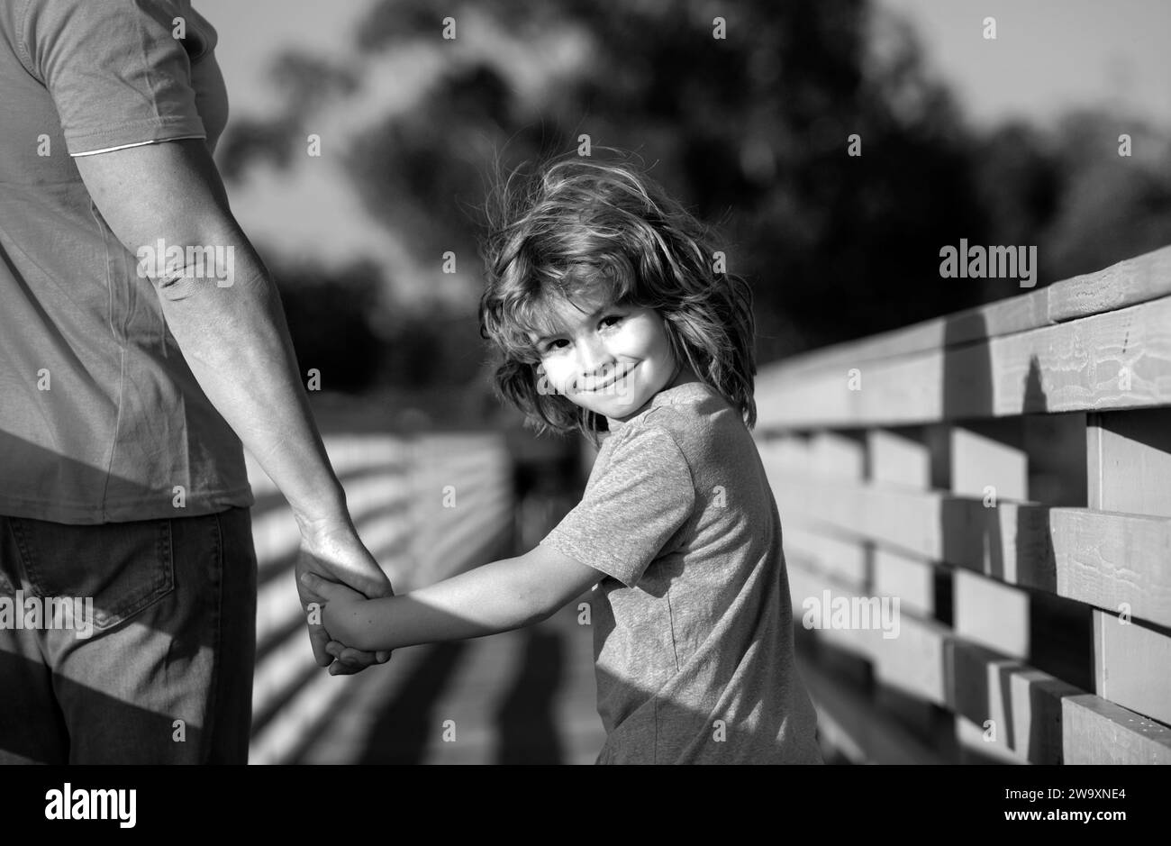 Father holding child son hand. Parenting concept Stock Photo - Alamy