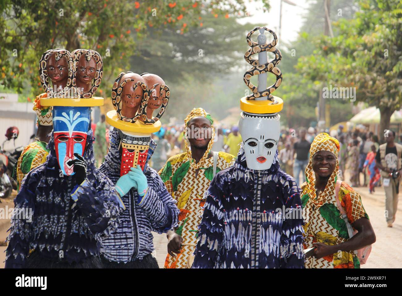 Ouidah, Benin. 30th Dec, 2023. Masked artists participate in the parade ...