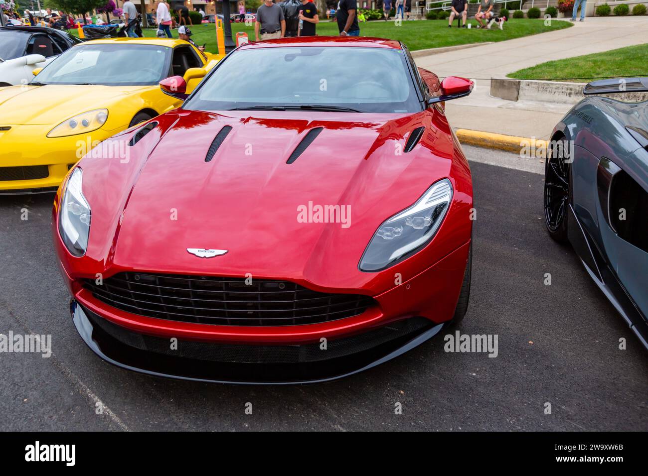 This yellow C6 Chevrolet Corvette and red Aston Martin DB11 are on ...