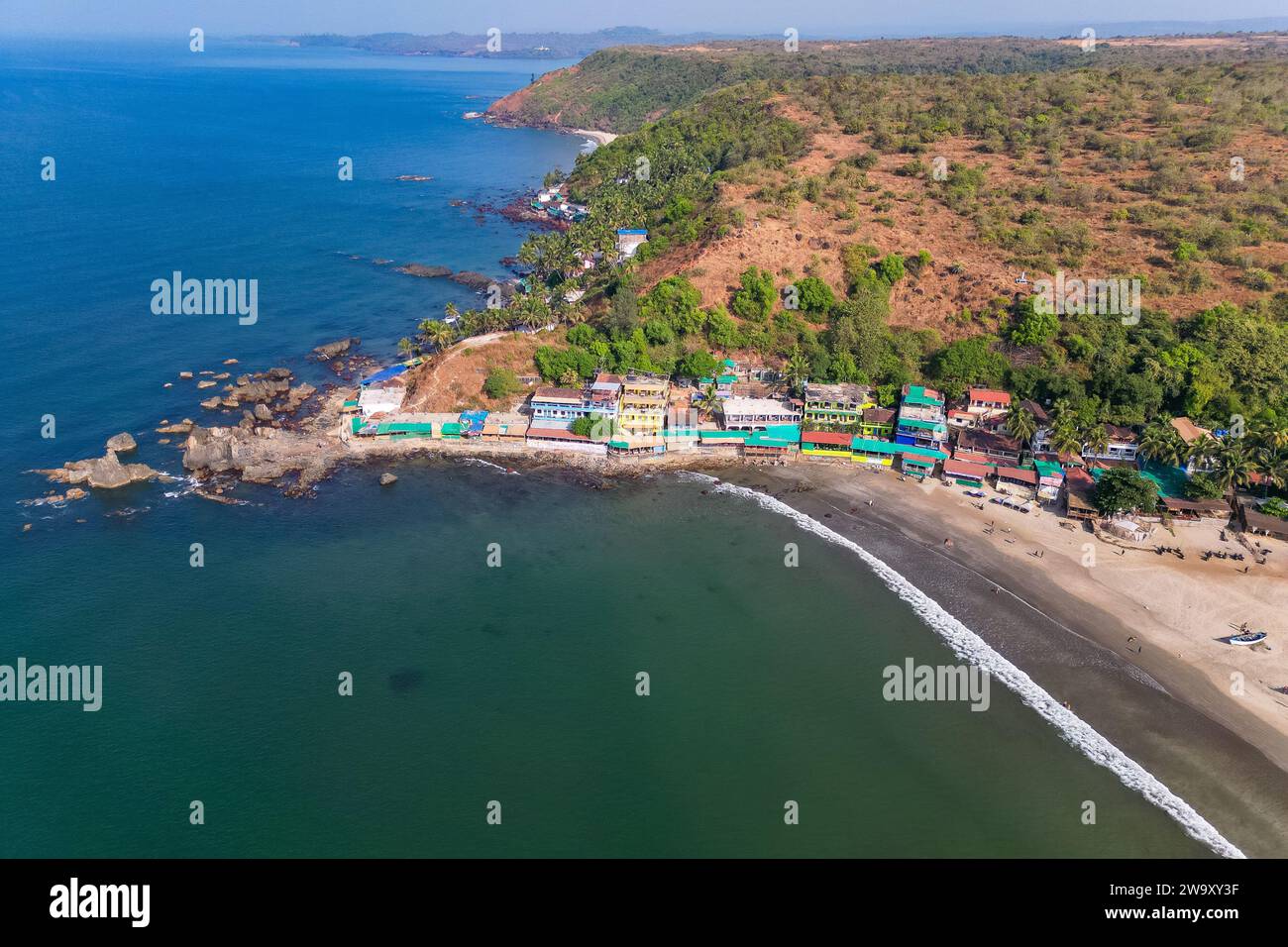 Aerial top view on tropical beach with green palm trees under sunlight ...