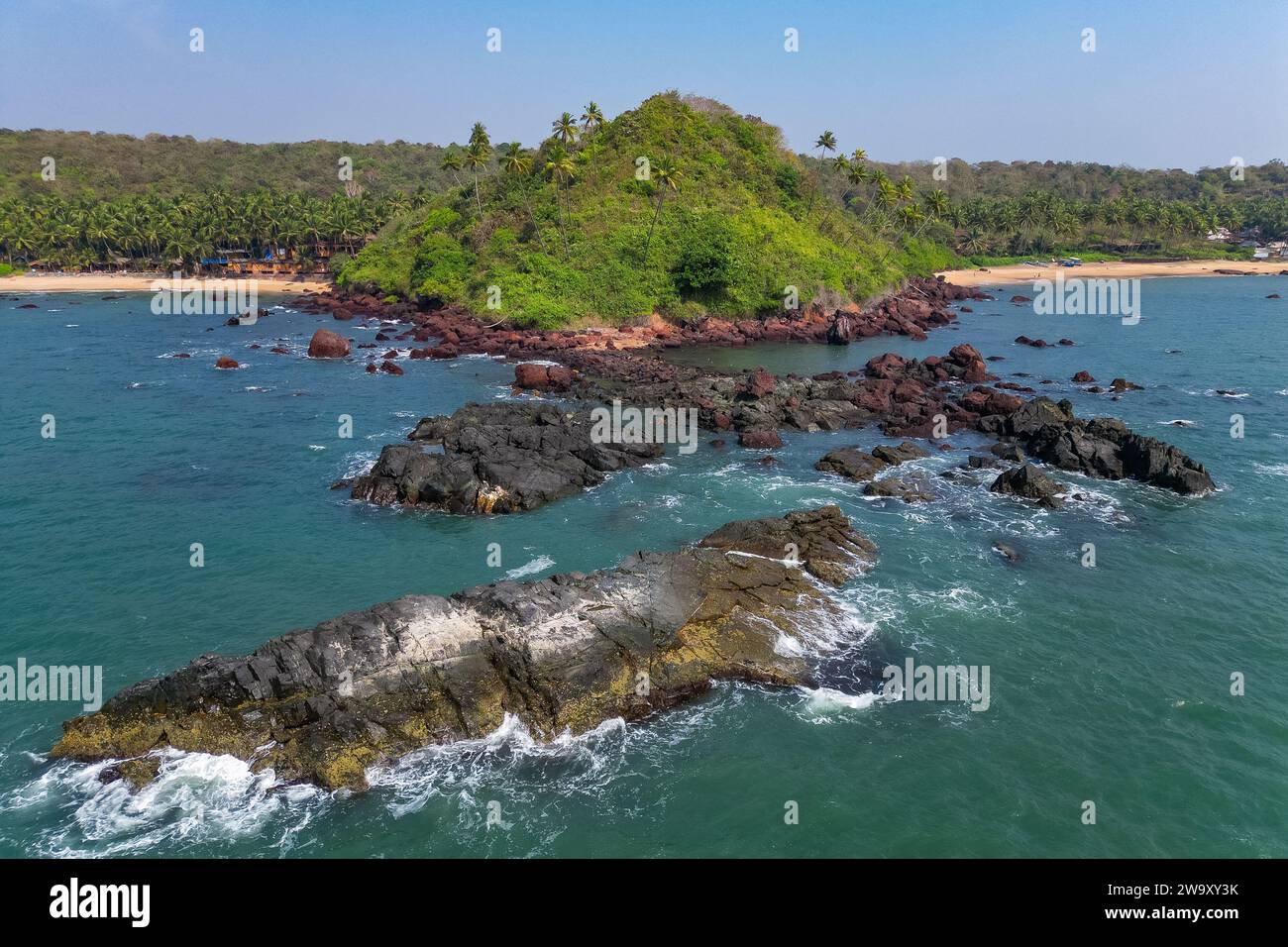 Aerial top view on tropical beach with green palm trees under sunlight ...