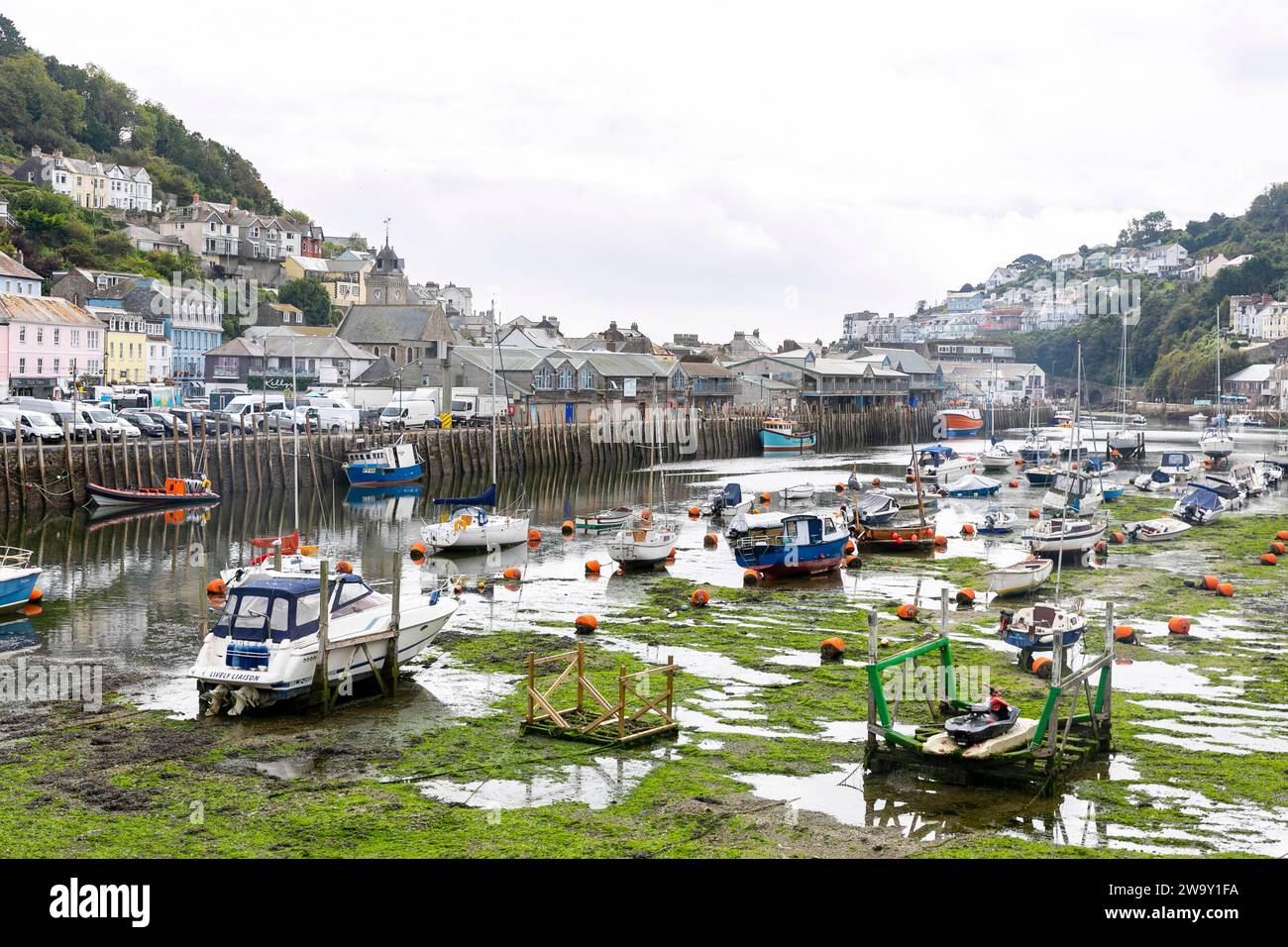 Looe River Cornwall and low tide in the harbour with fishing boats on ...