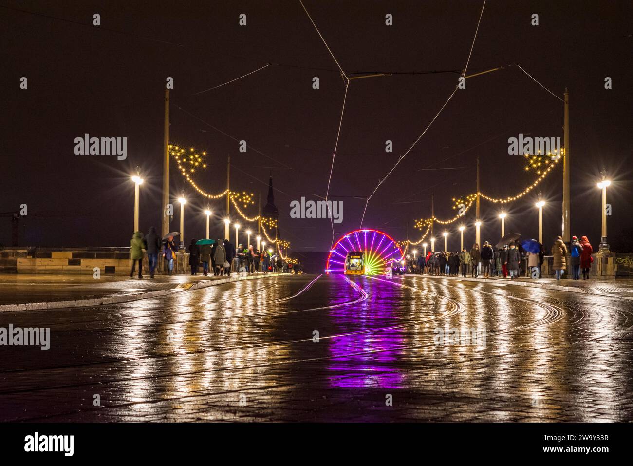 illuminated ferris wheel, bridge Augustusbrücke, streetcar tracks ...
