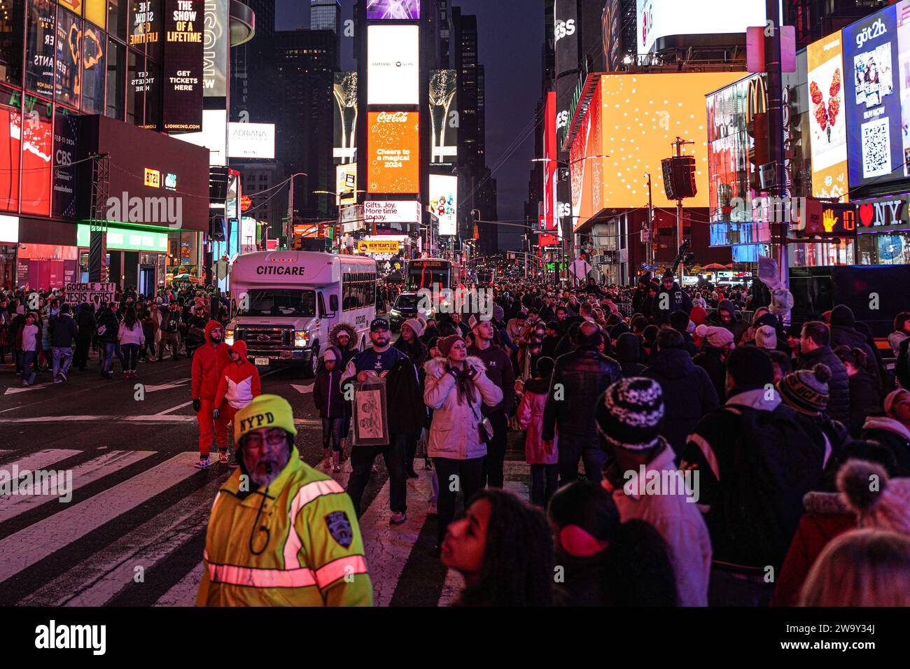 People walk on the streets at Times Square and block the cars. Road ...