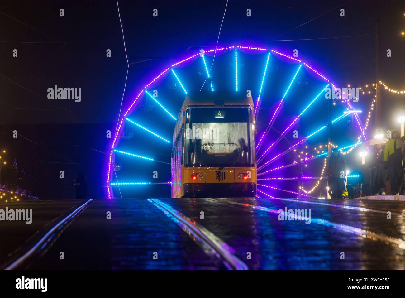 illuminated ferris wheel, bridge Augustusbrücke, streetcar tracks ...