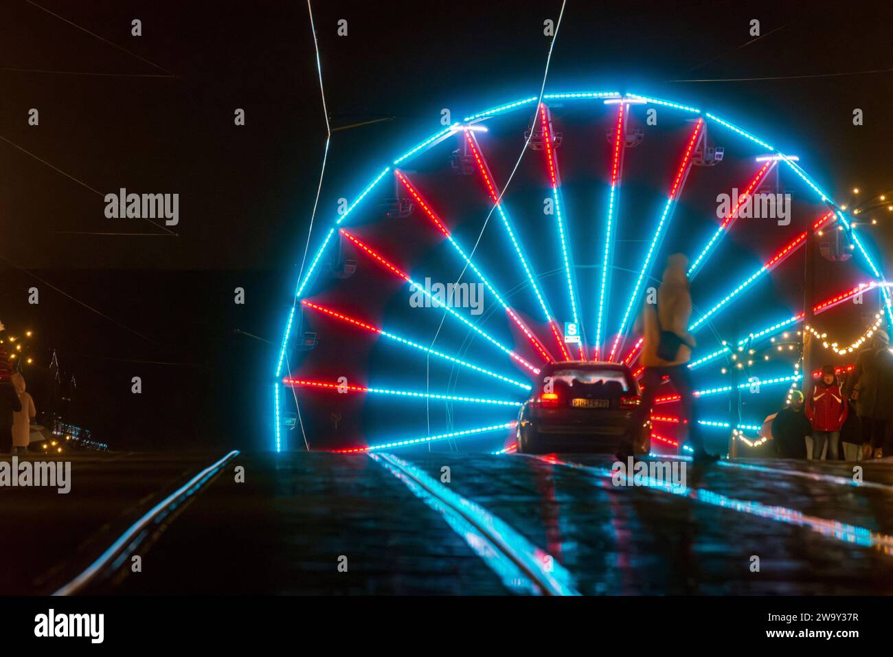 illuminated ferris wheel, bridge Augustusbrücke, streetcar tracks ...