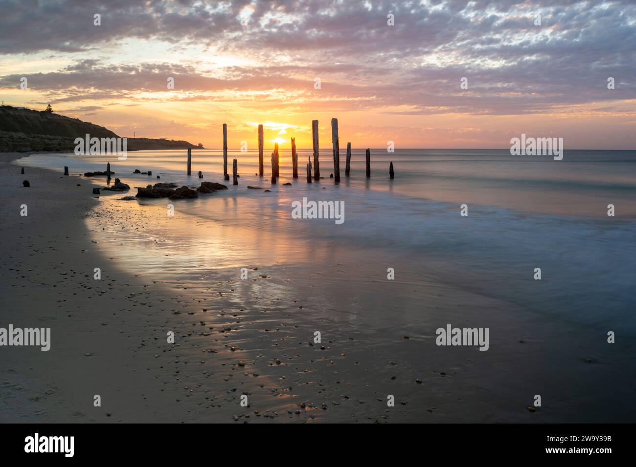 Port Willunga beach jetty ruins in South Australia alight with the glow ...