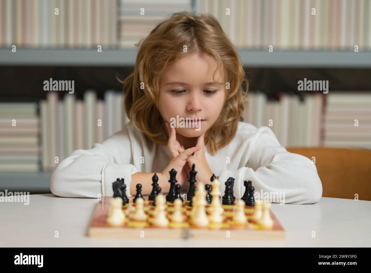Little child chessman play chess game, checkmate. Kids early ...
