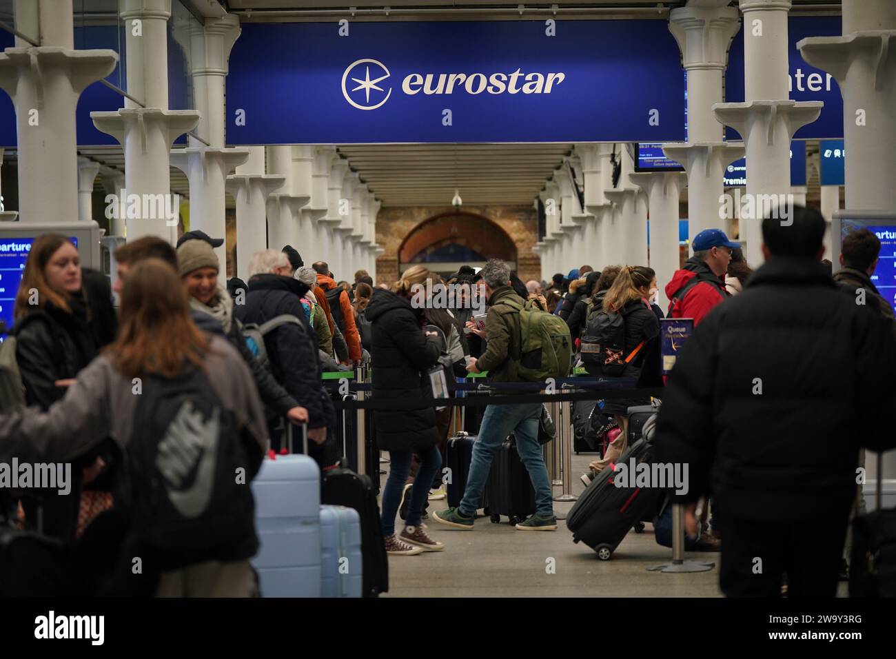 Passengers in line at the Eurostar terminal in St Pancras International ...