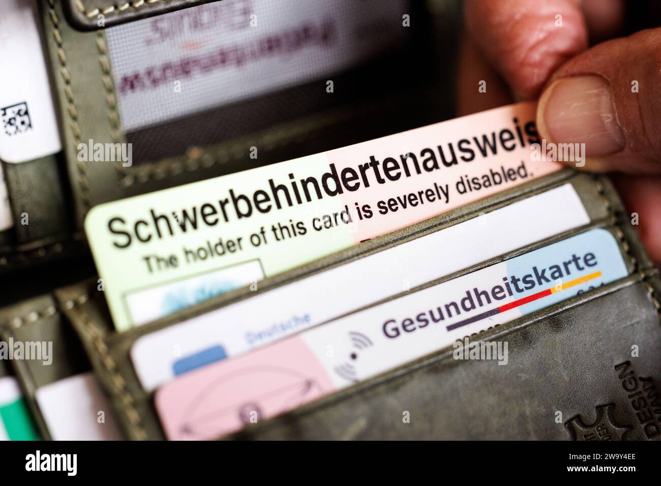 Norden, Germany. 28th Dec, 2023. An elderly lady takes her disabled ...