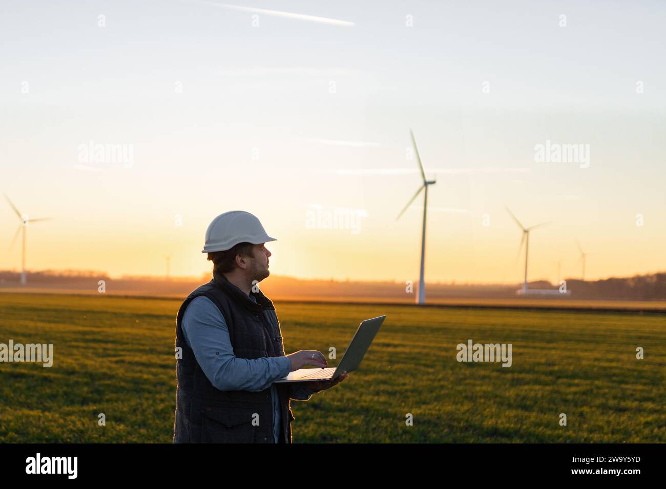 Electrical engineers working at wind turbine power generator station ...