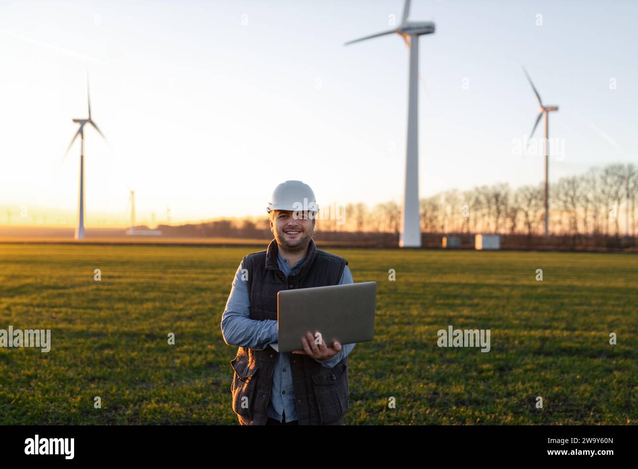 Electrical engineers working at wind turbine power generator station ...