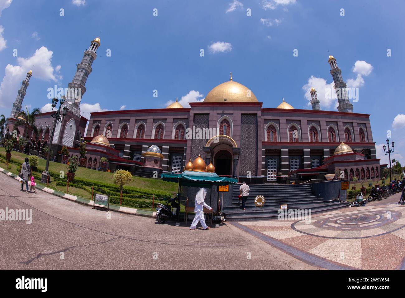 People walking outside, Dian Al-Mahri Mosque, also known as Golden Dome ...