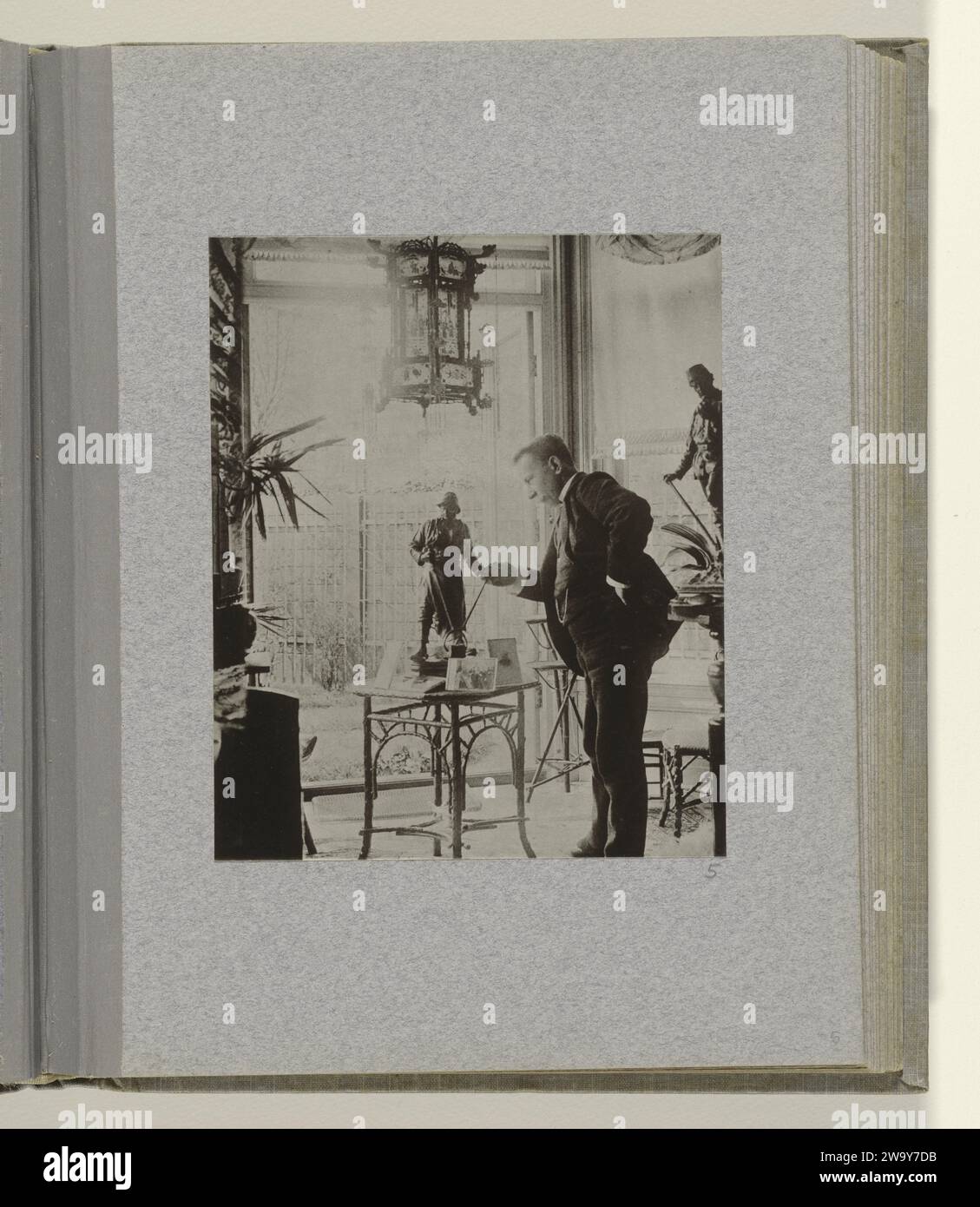 J.B. Aug. Kessler in the garden room, on the table photos and an image ...