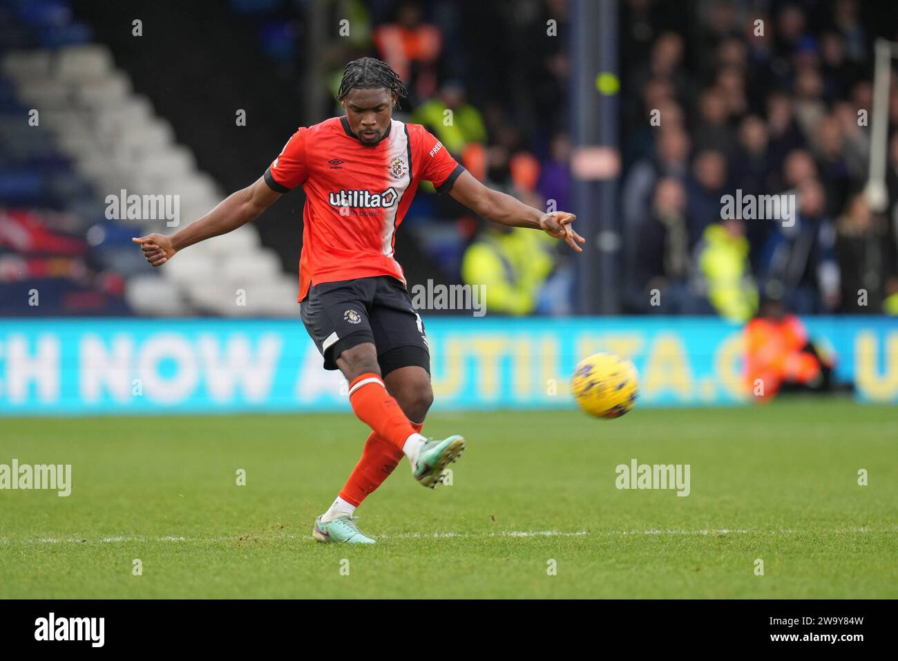 Luton, UK. 30th Dec, 2023. Teden Mengi (15) of Luton Town during the ...