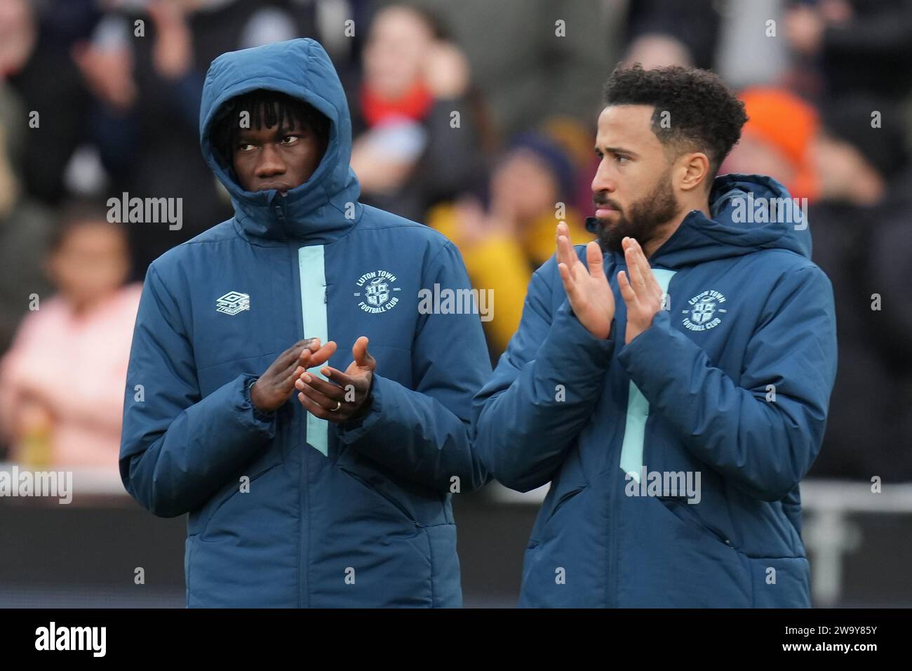 Luton, UK. 30th Dec, 2023. Issa Kabore (12) of Luton Town and Andros ...