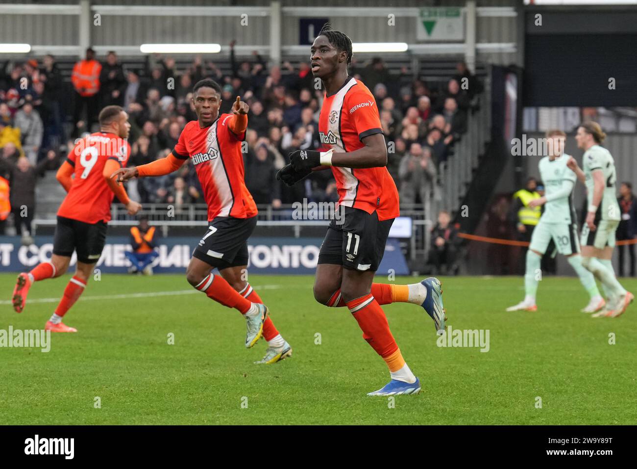 Luton, UK. 30th Dec, 2023. Elijah Adebayo (11) of Luton Town celebrates ...
