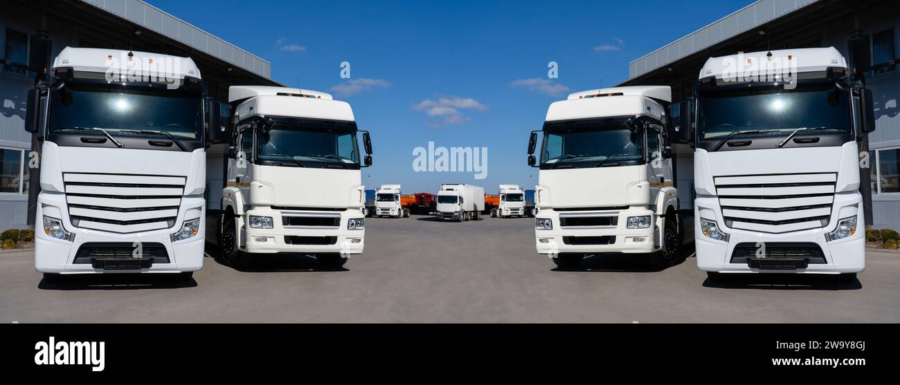 Semi truck fleet at the logistics center Stock Photo - Alamy
