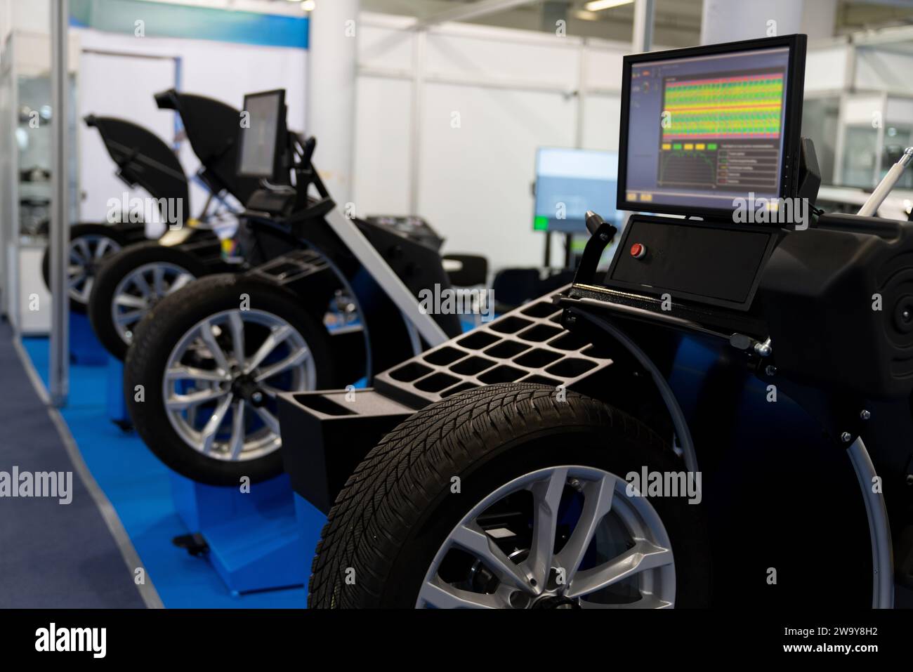 Car wheel balancing device for tire fitting Stock Photo - Alamy