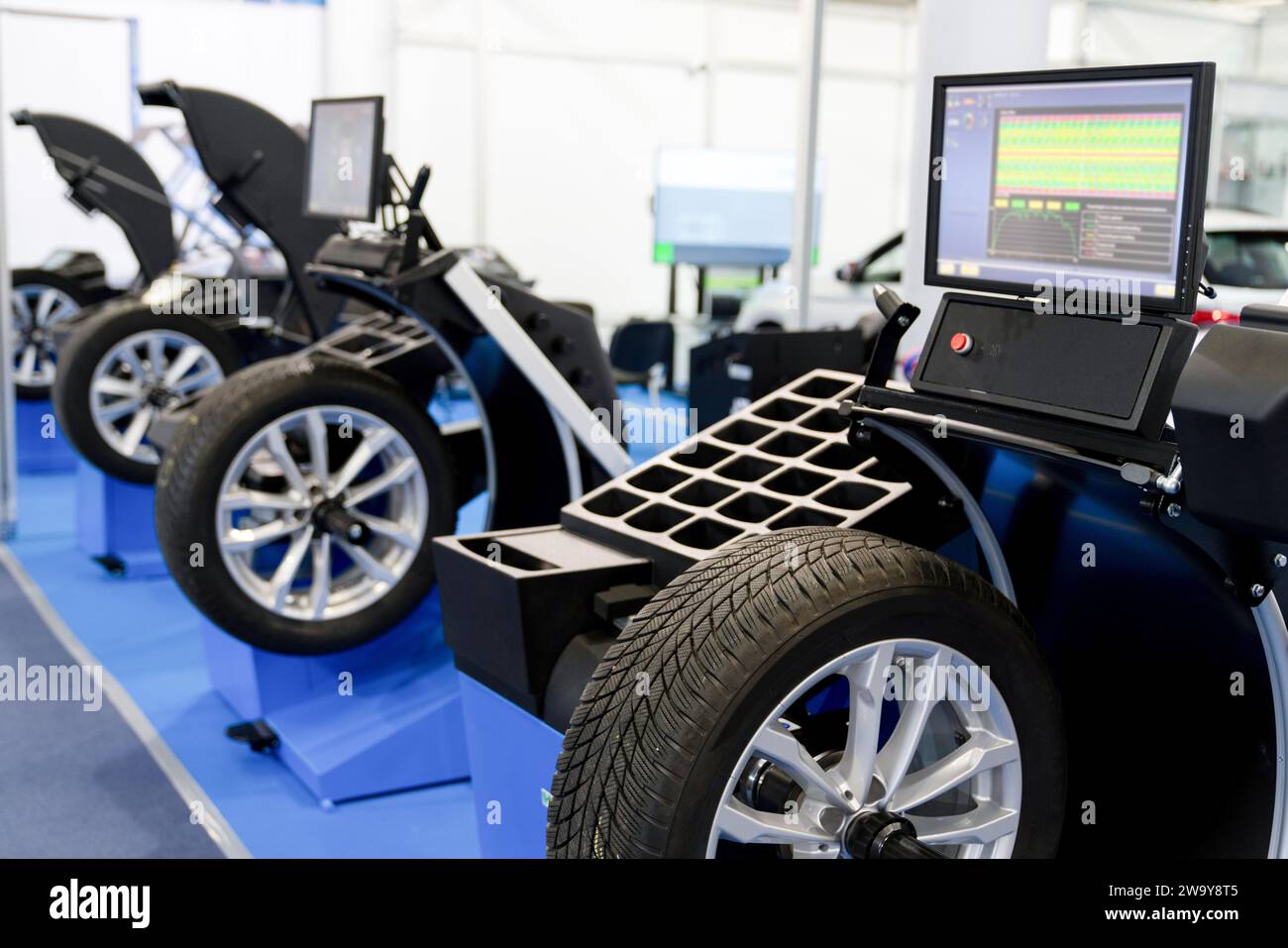 Car wheel balancing device for tire fitting Stock Photo - Alamy
