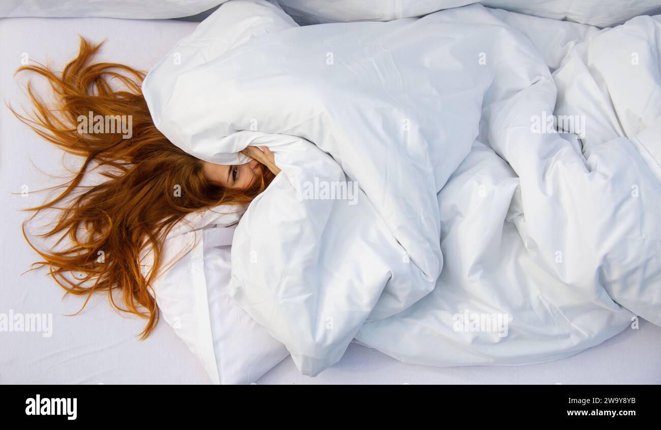 Woman under sheets hi-res stock photography and images - Alamy