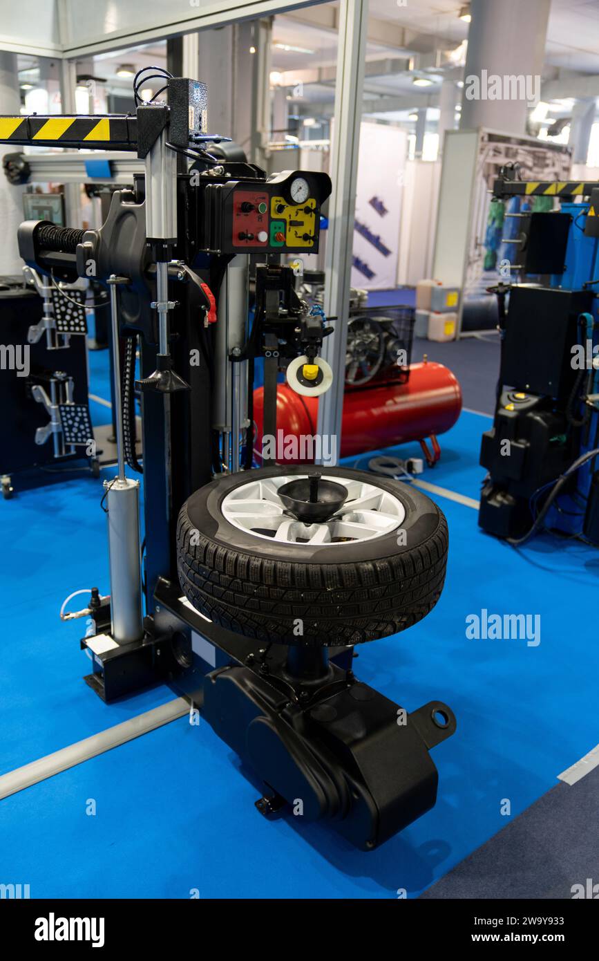 Car wheel balancing device for tire fitting Stock Photo - Alamy