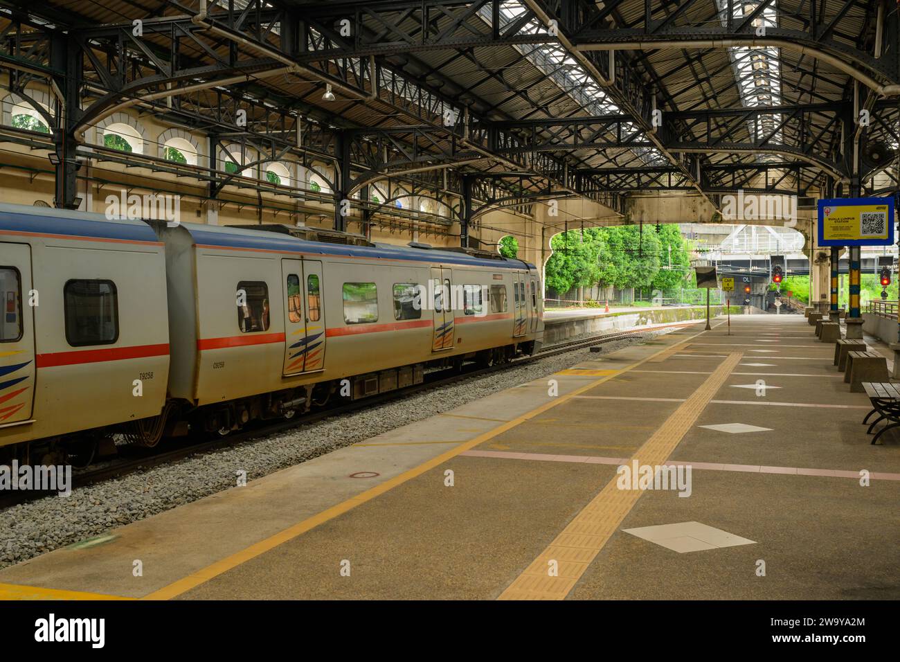 An departing KTM Kommuter train at Kuala Lumpur Railway Station, Kuala ...