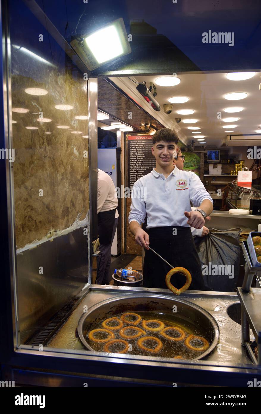Istanbul, Turkey - December 12, 2023: A chef show the traditional Halka ...