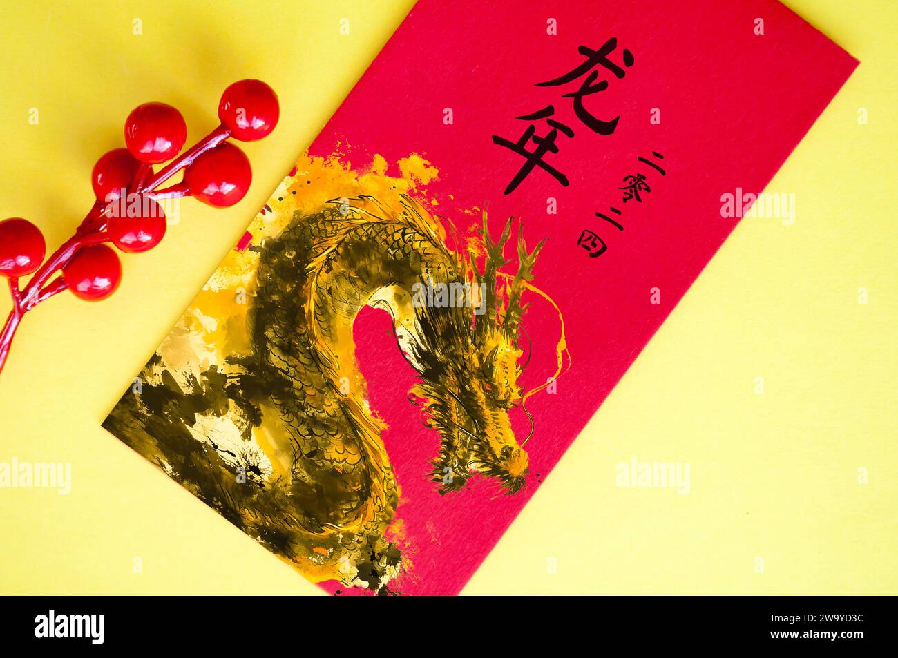 Top view of Chinese New Year red packet with golden dragon and cherry ...