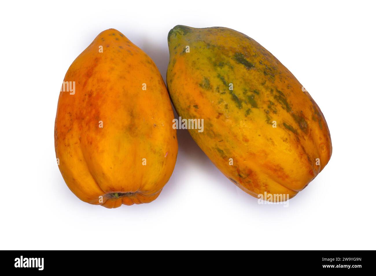 whole two papaya fruit isolated on white background Stock Photo - Alamy