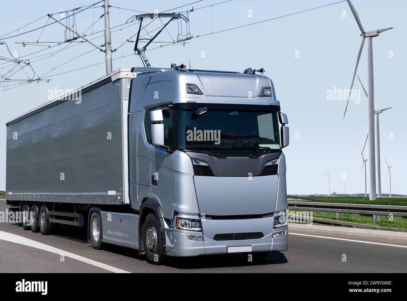 Electric semi truck with pantograph takes energy from wires above the ...