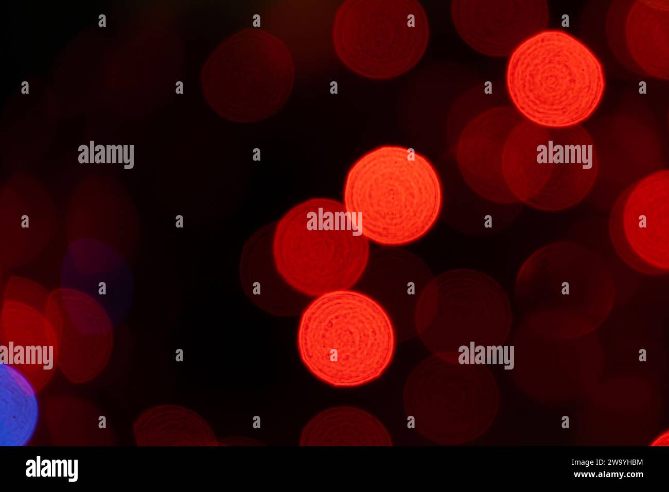 Abstract defocused overlay background. Red bokeh lights on black ...