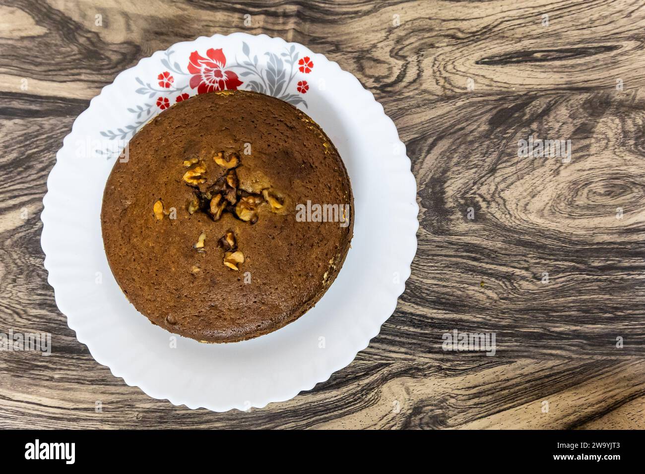 home baked delicious brown cake from top angle Stock Photo - Alamy