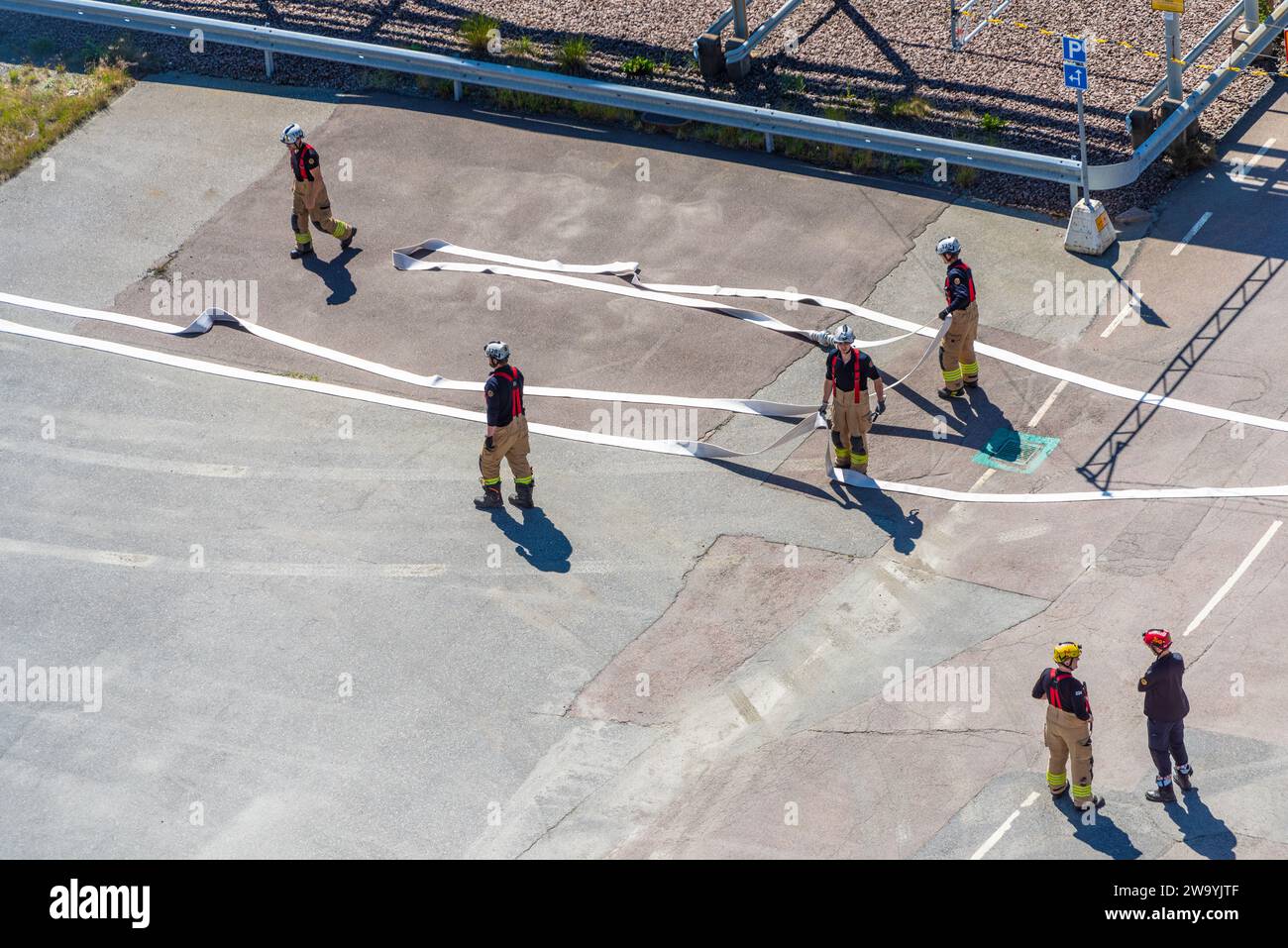 Gothenburg, Sweden - May 29 2022: Firefighters arranging fire hoses at ...