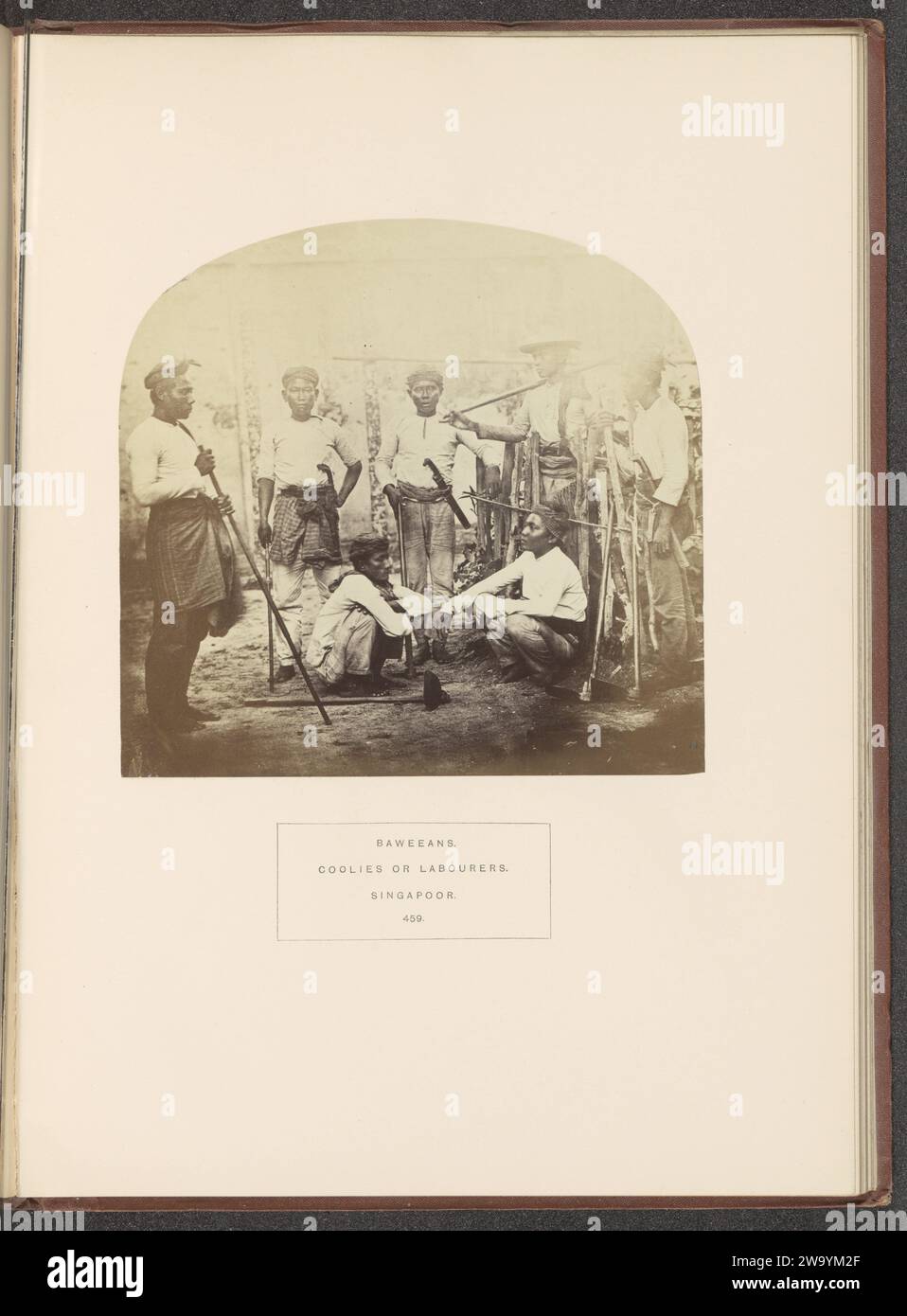 Portrait of seven unknown men from Bawean with agricultural equipment ...