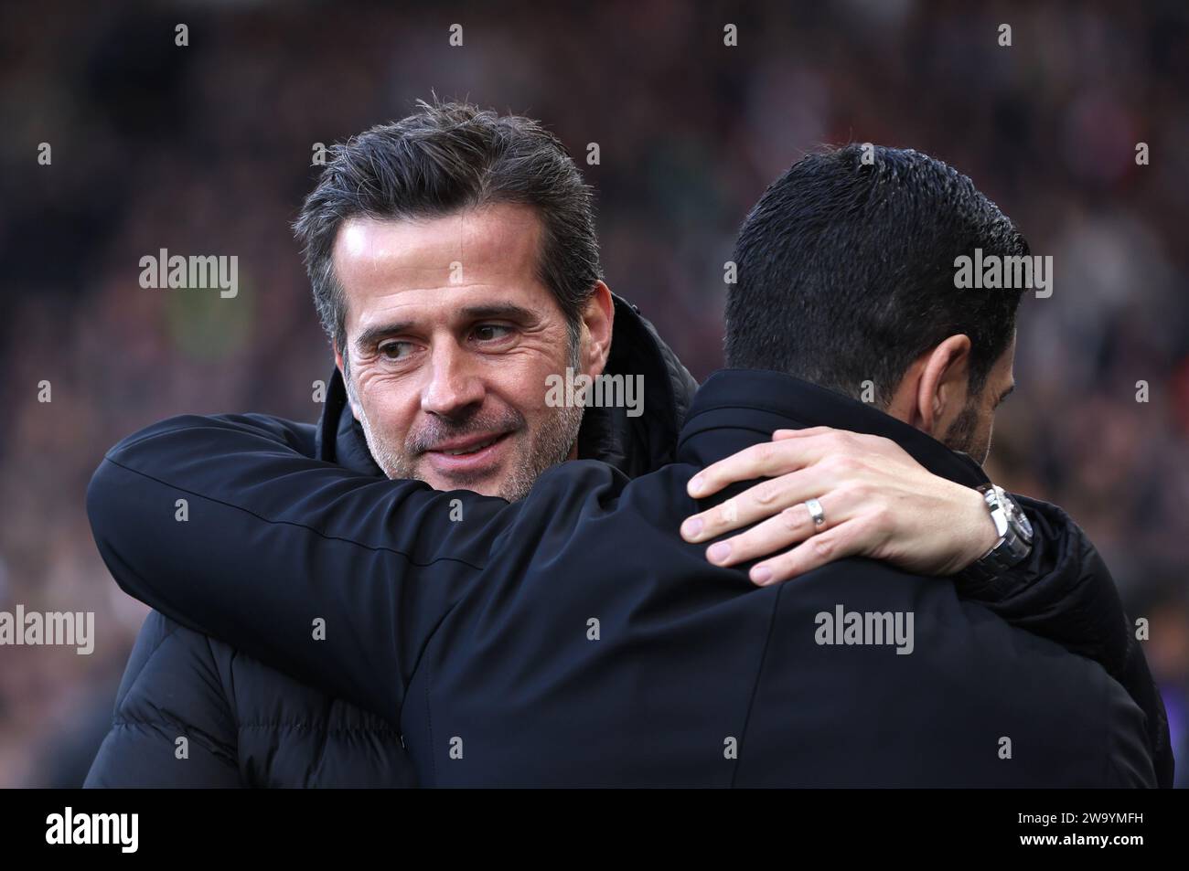 Fulham manager Marco Silva hugs Arsenal manager Mikel Arteta ahead of ...