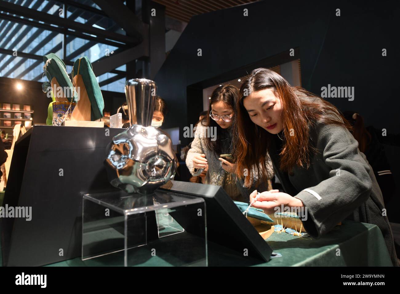 Chengdu, China's Sichuan Province. 31st Dec, 2023. Tourists buy ...