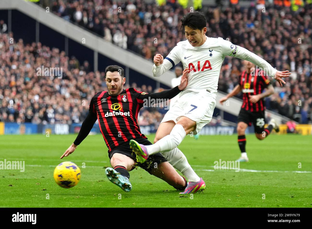 Tottenham Hotspur's Son Heung-Min (right) attempts a shot on goal past ...