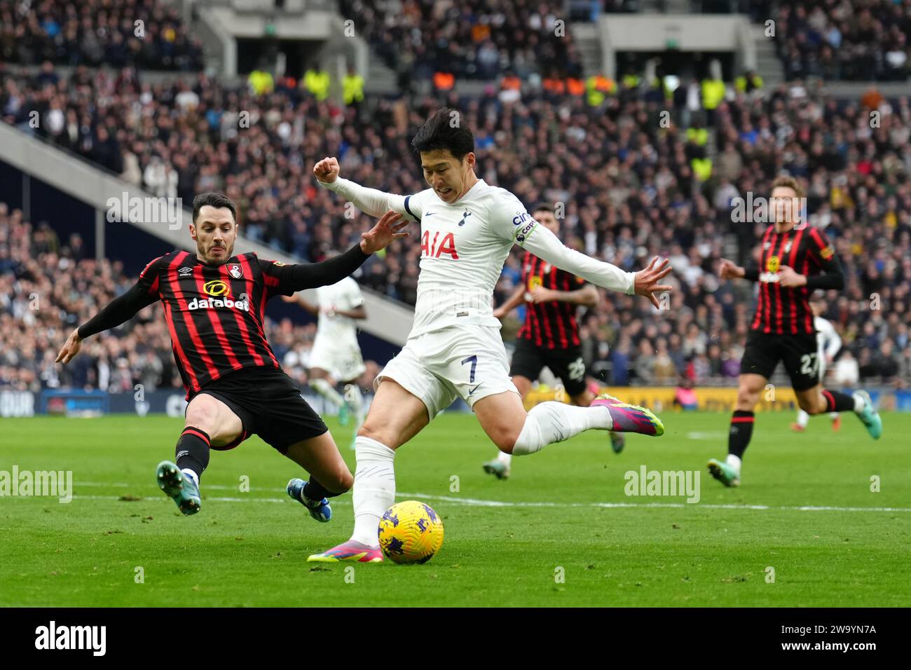 Tottenham Hotspur's Son Heung-Min (right) attempts a shot on goal past ...