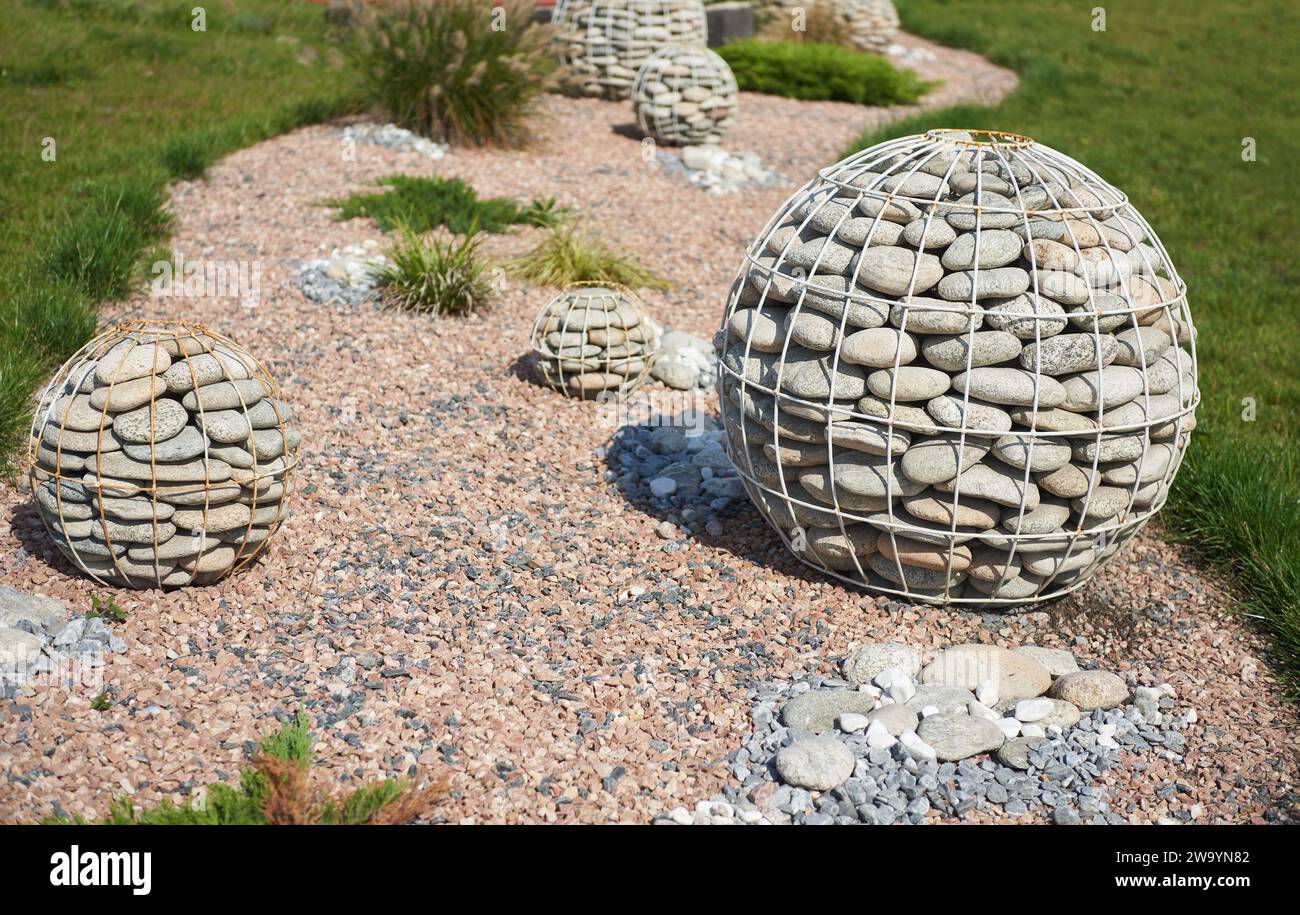 Landscape design with backfill of stones and stone figures Stock Photo ...